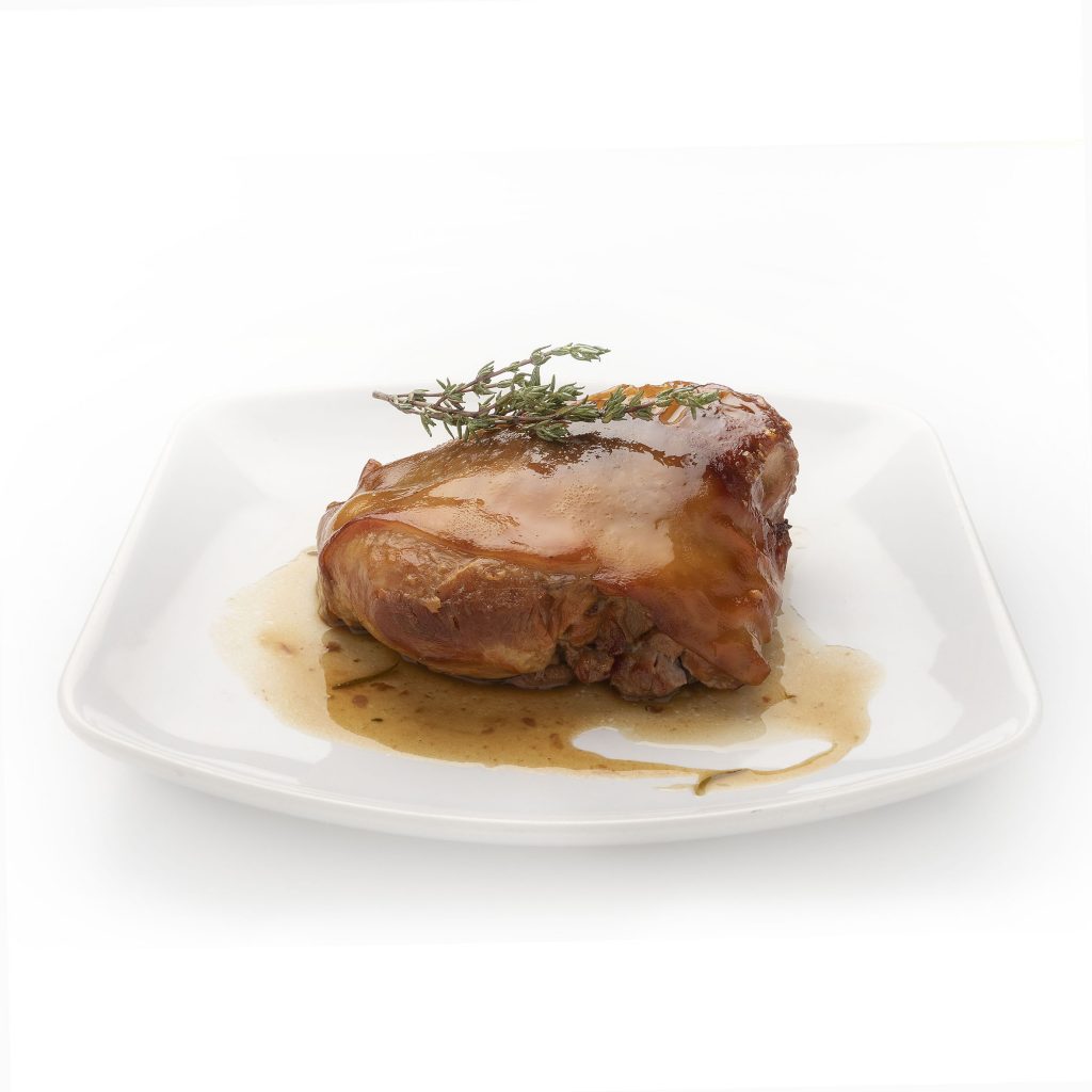 Tostón asado | Restaurante Cala Fornells